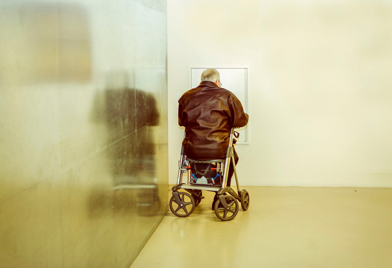 Senior sitting on a walker, a Health & Medical Photo by Patricia Hofmeester