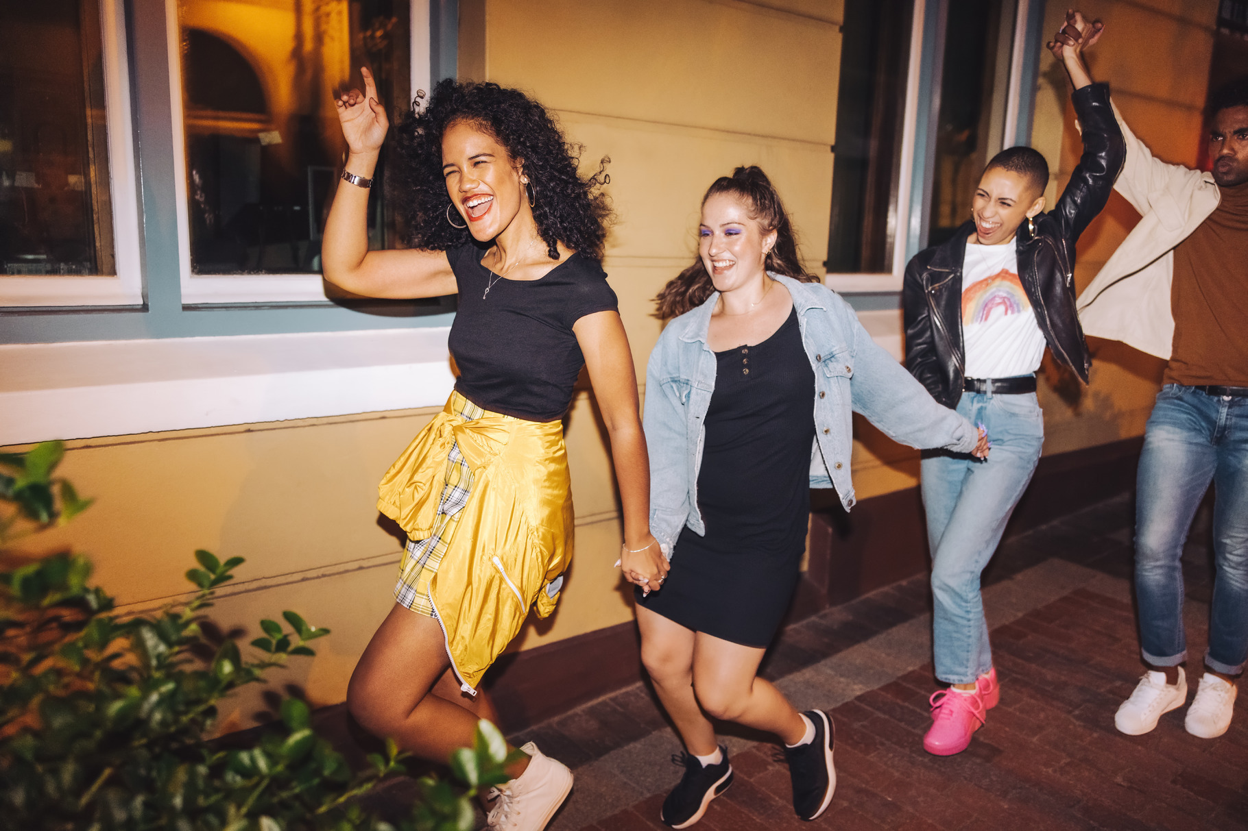 Friends dancing joyfully at night, a Person Photo by Jacob Lund