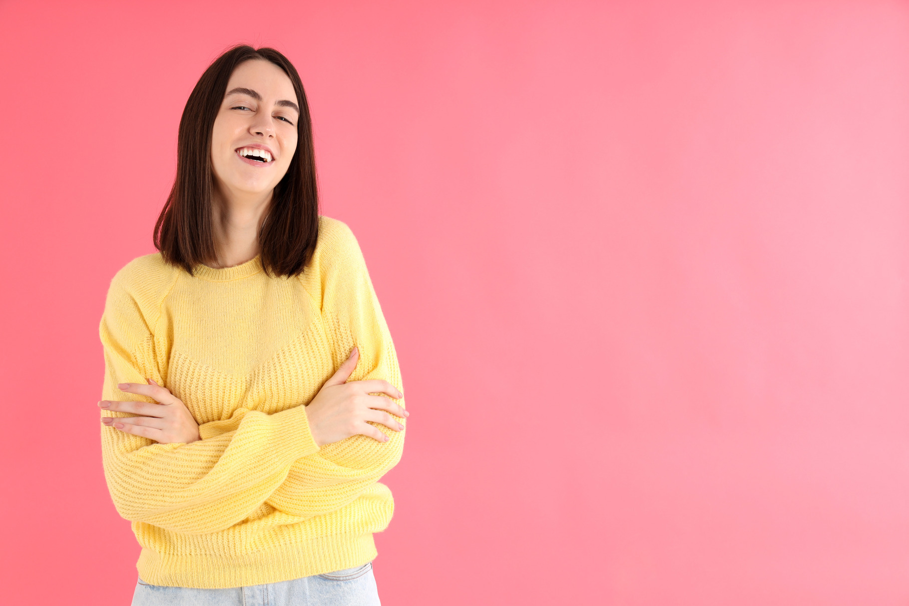 Attractive girl in yellow sweater on pink background, a Person Photo by ...