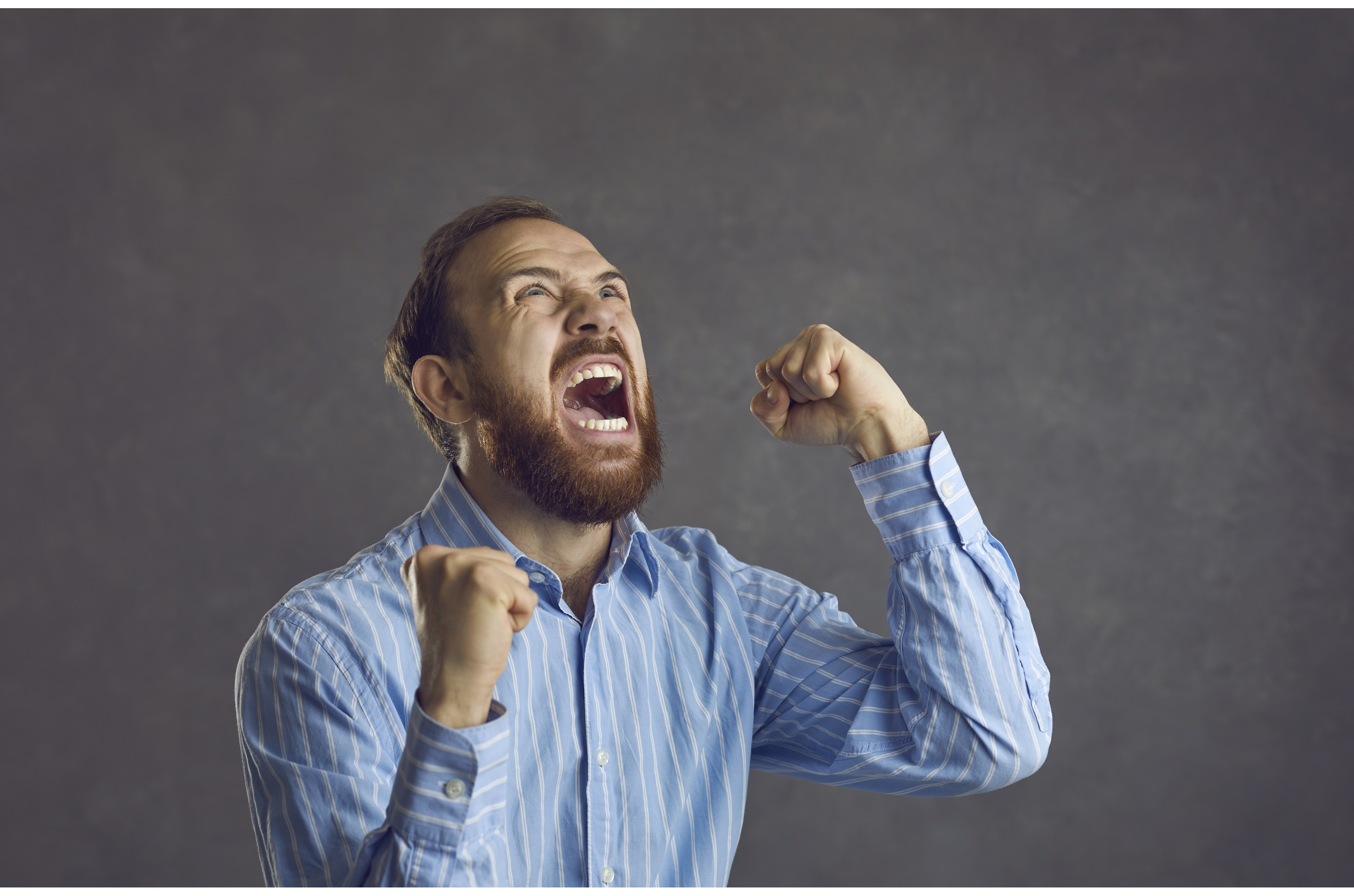 An angry frustrated aggressive young, a Person Photo by StudioRomantic
