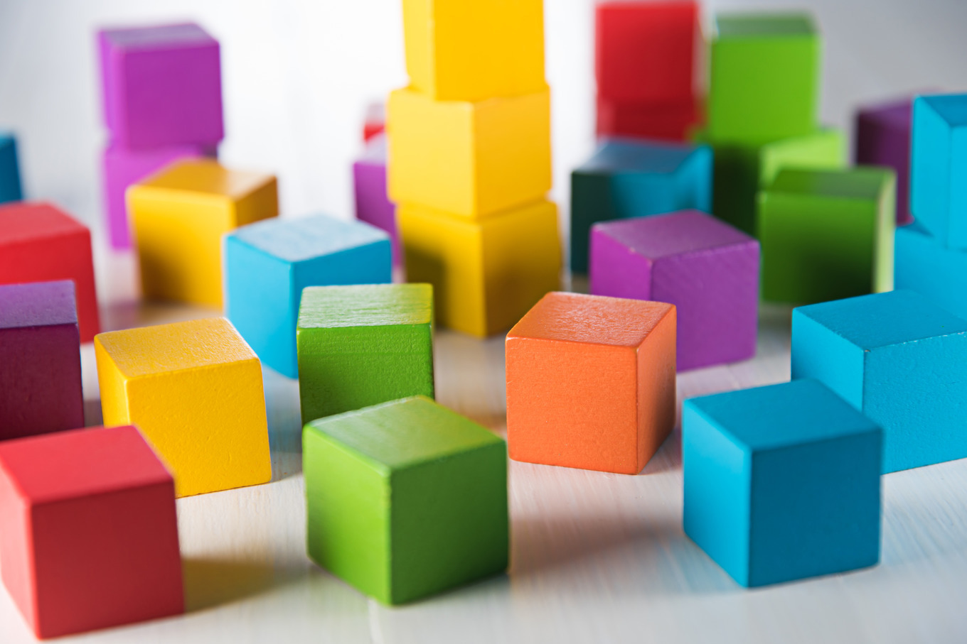 Colorful wood cube building blocks featuring architecture, background ...