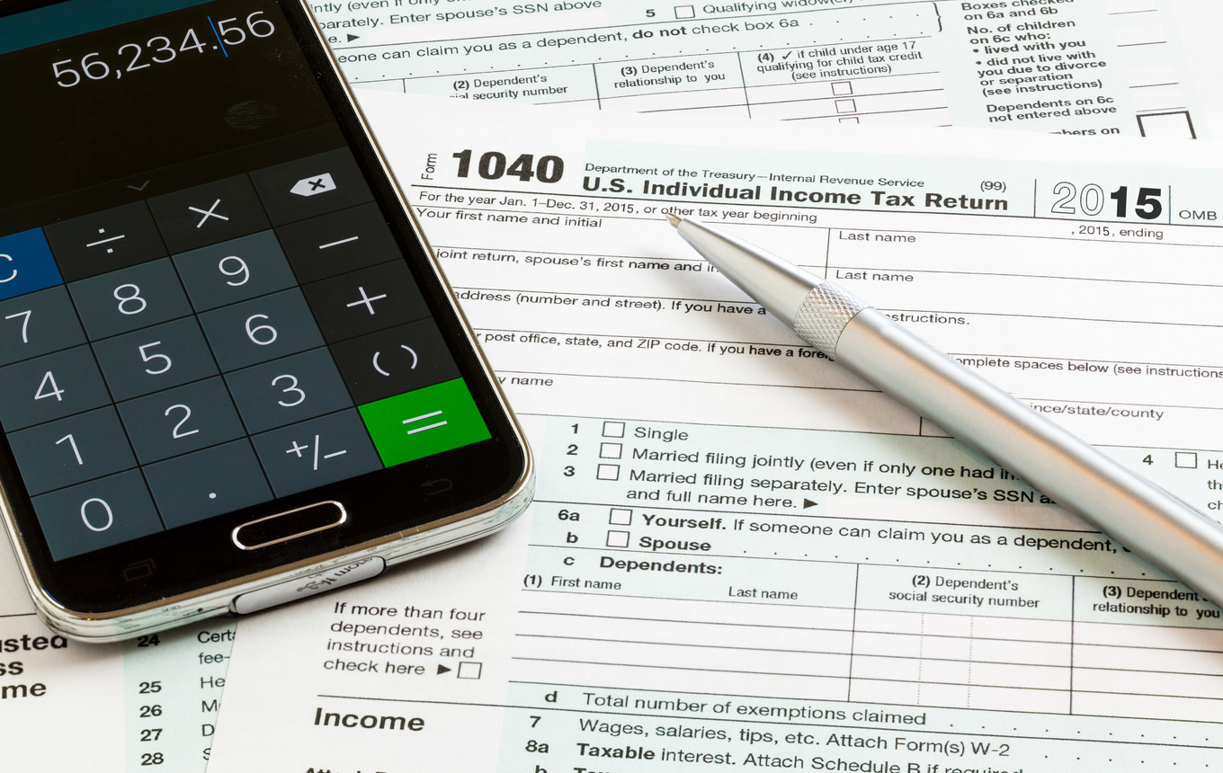 Completing form 1040 for IRS, a Business Photo by Backyard Stock ...