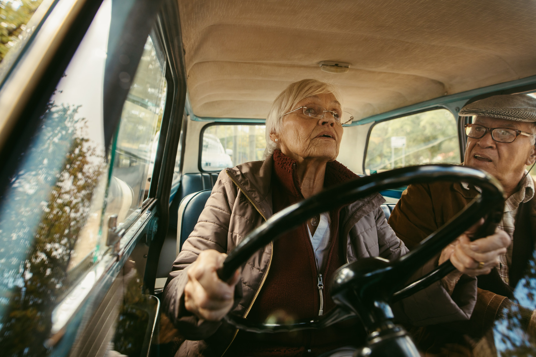 Elderly couple driving, a Person Photo by Jacob Lund
