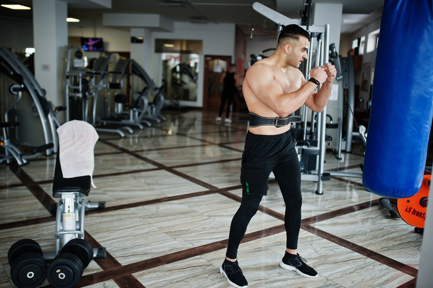 Muscular arab man training in modern gym. Fitness arabian men wi, a ...