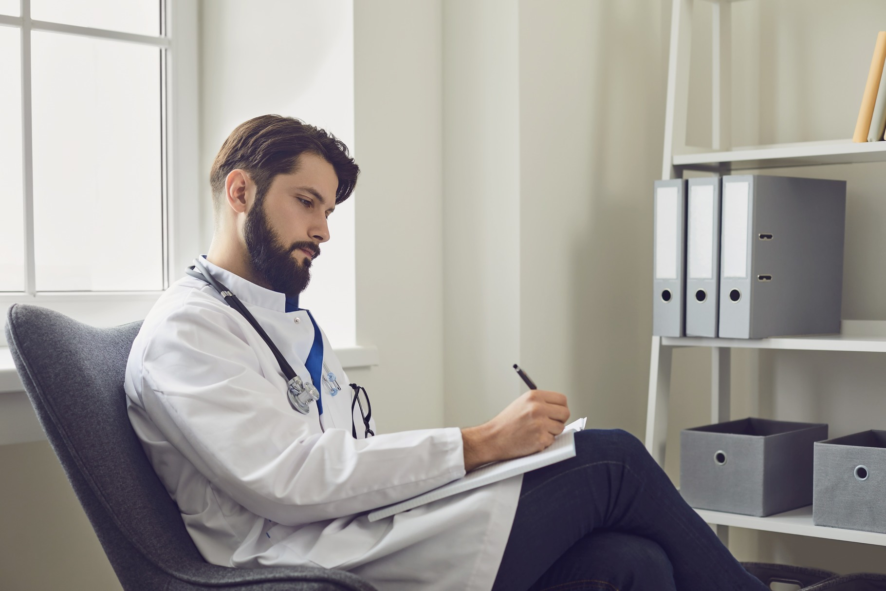 Side view of young male doctor, a Person Photo by StudioRomantic