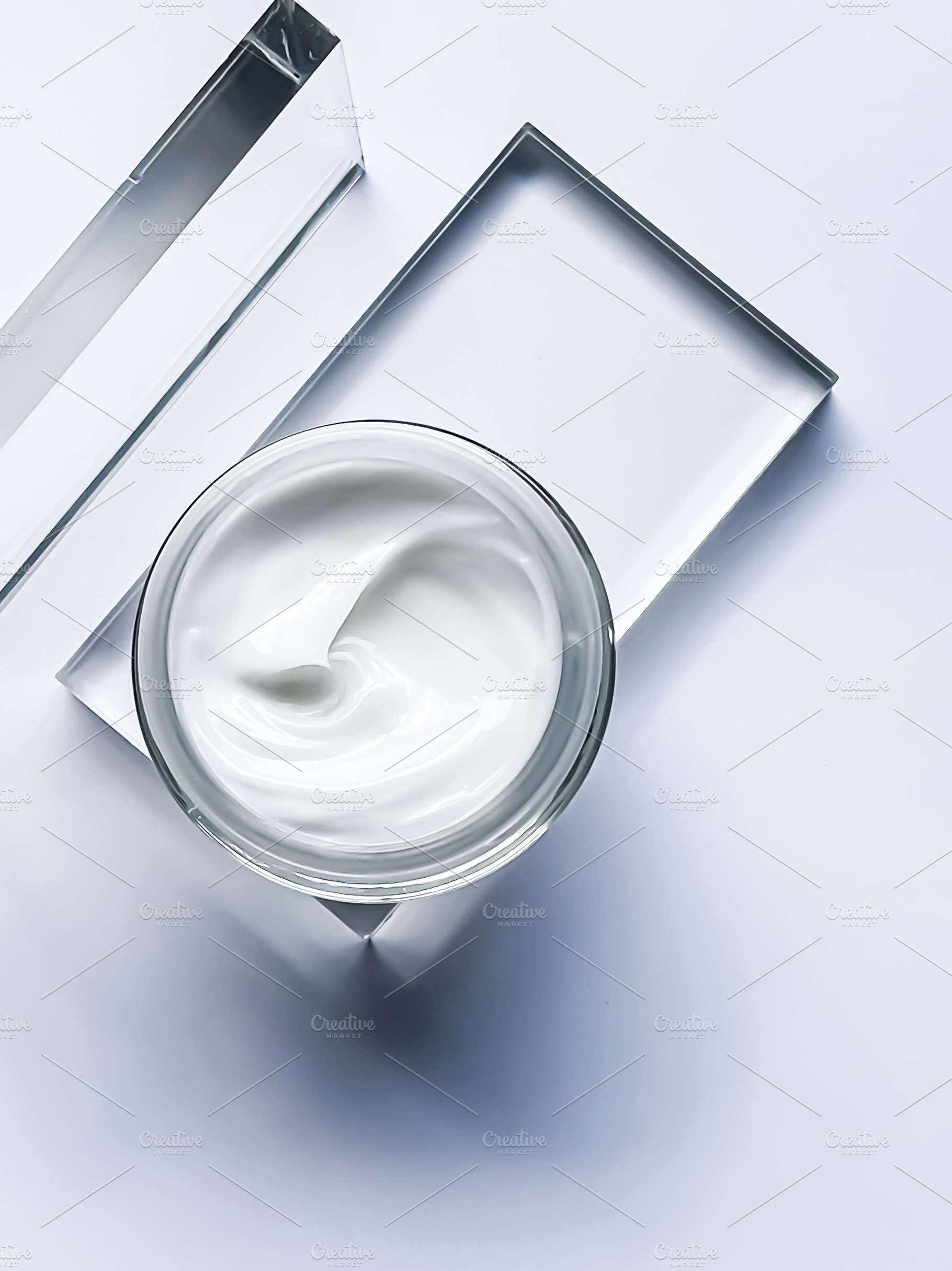 Face cream moisturiser jar and product sample on glass, beauty a, a ...