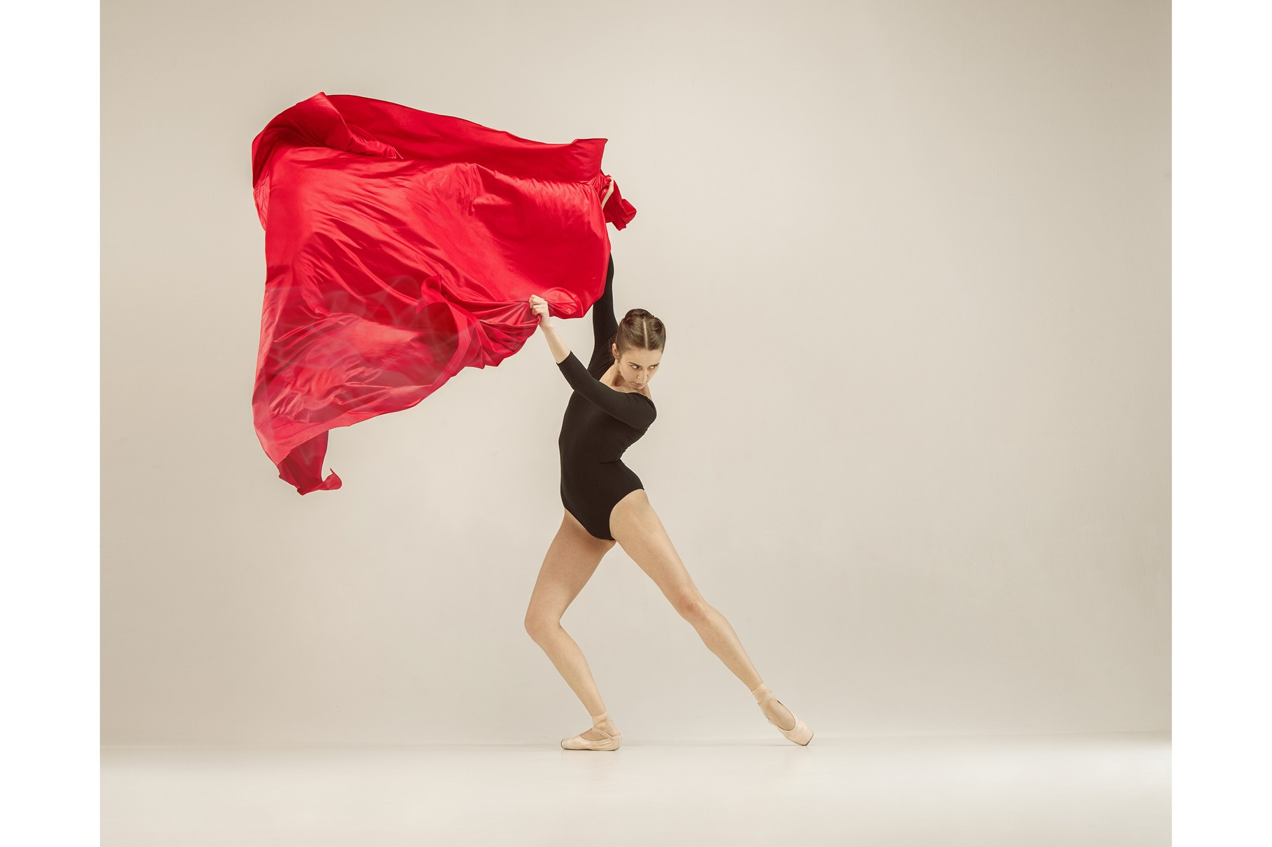 Modern ballet dancer dancing in full body on white studio background, a ...