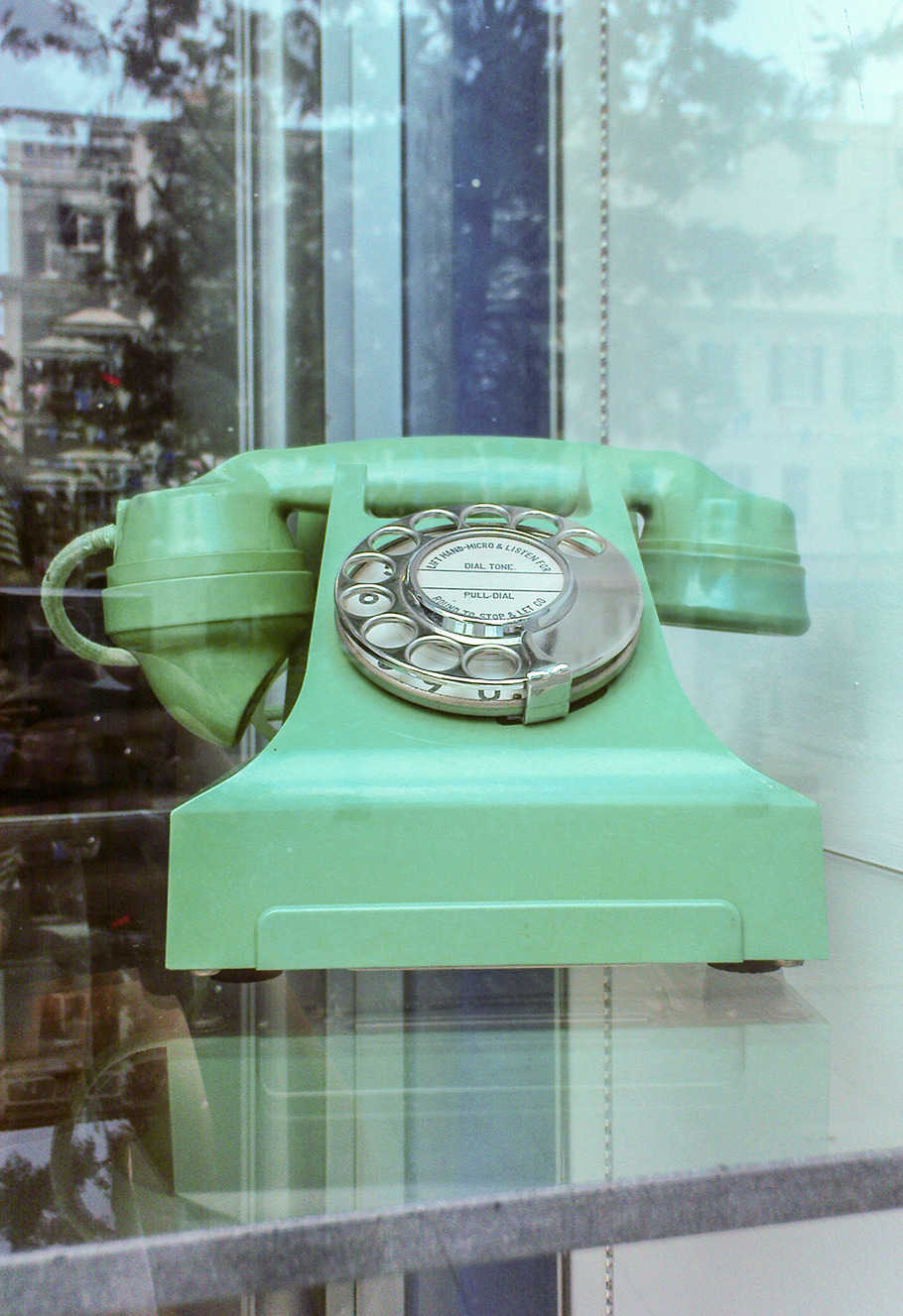Vintage green telephone on store she, a Technology Photo by DegImages
