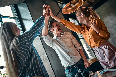 Positive team cheering female collea | Stock Photos ~ Creative Market