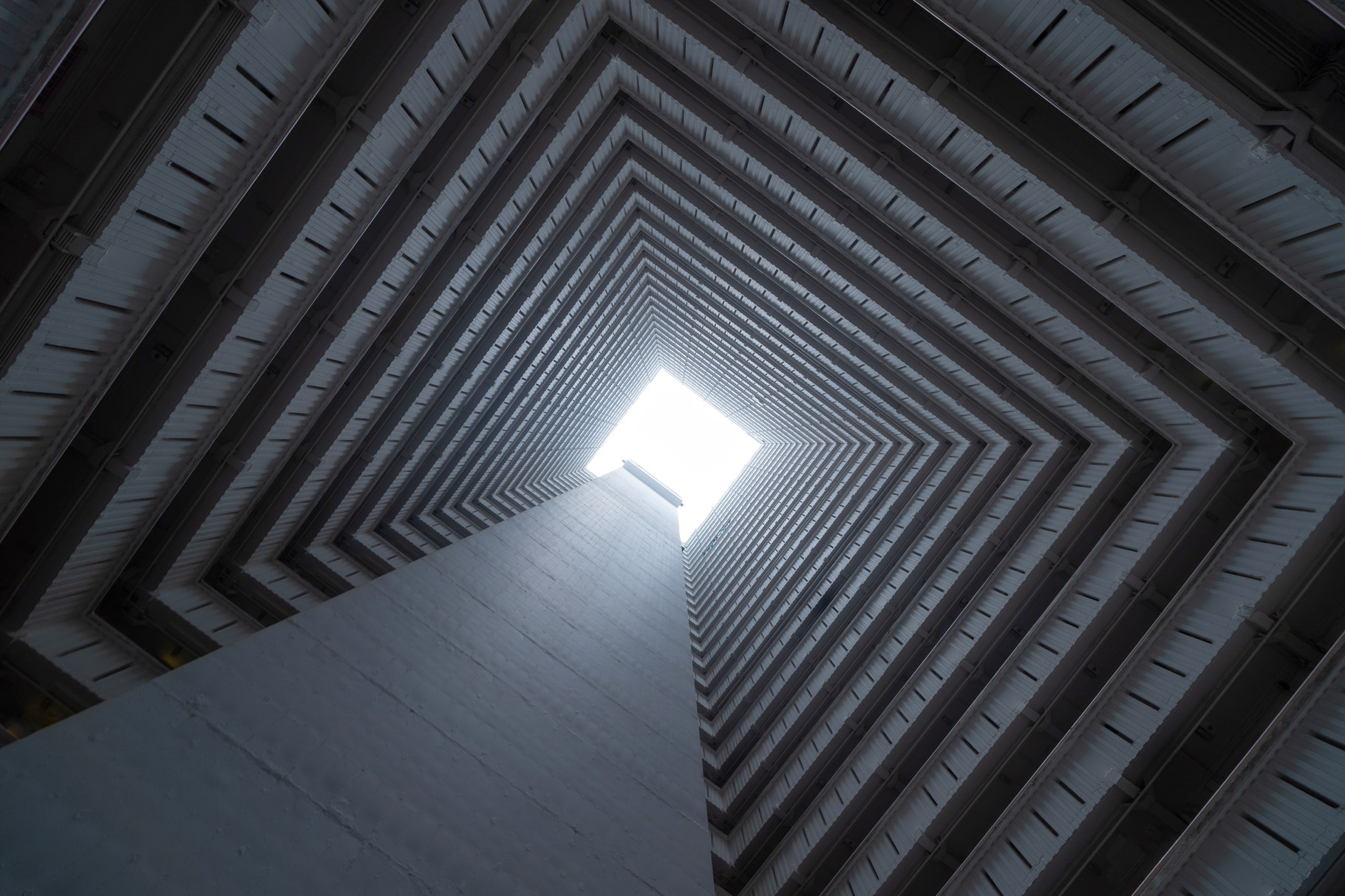 Bottom view of stack building floors featuring building, sky, and light ...