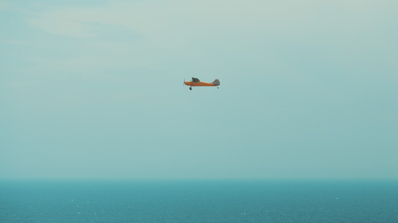 Orange one engine prop plane, a Transportation Photo by SkyNext