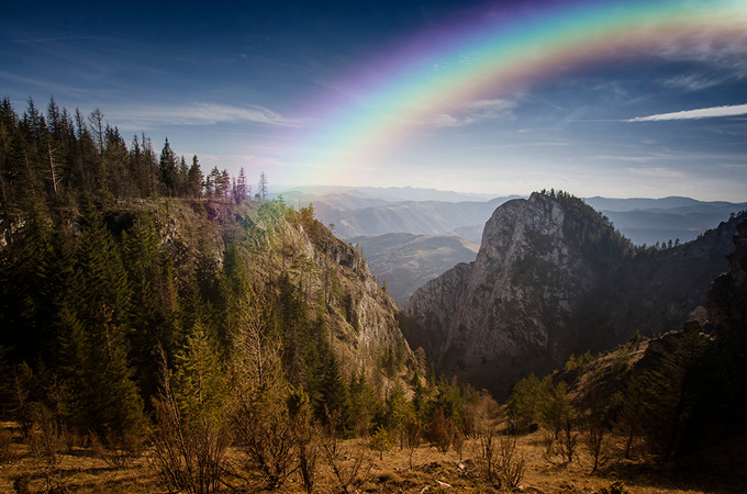 Rainbow over mountain with big cliff, a Nature Photo by Atmospheric ...