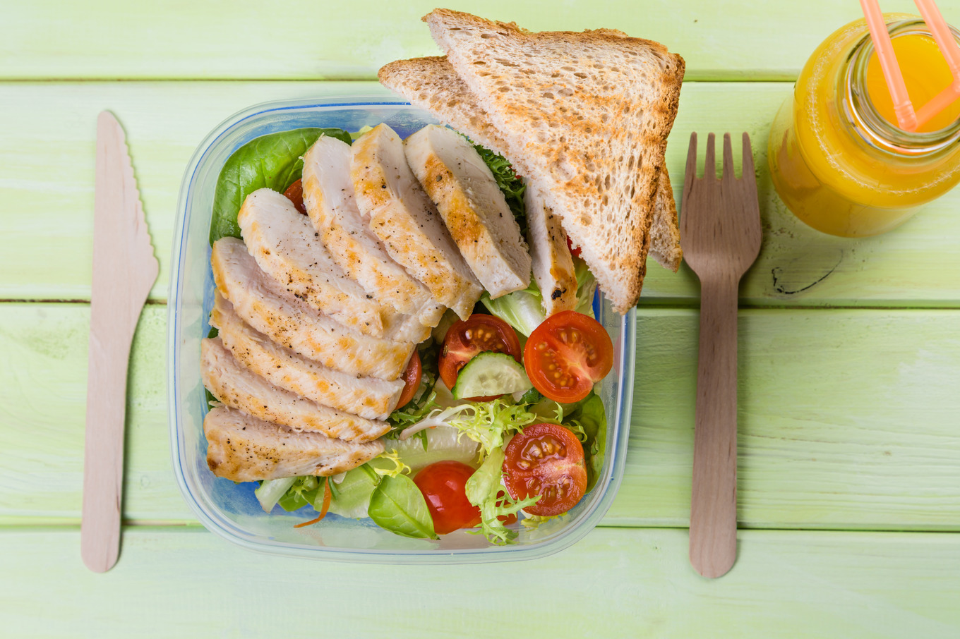 Lunch box with salad and chicken featuring lunch, salad, and box, a ...