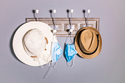 Coat rack with a hats and a pair of, a Health & Medical Photo by Cosca