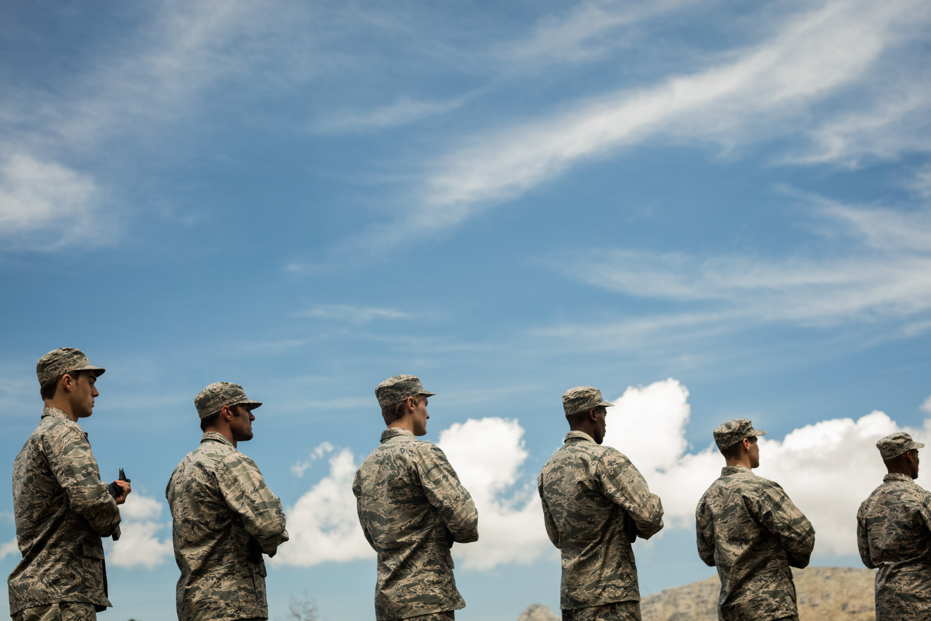 Group of military soldiers standing, a Photo by WavebreakPremium