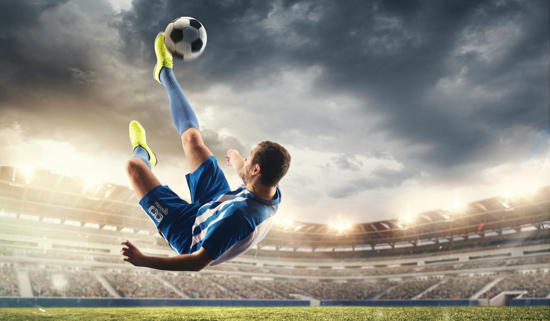 Male football or soccer player at stadium - motion, action, activity ...
