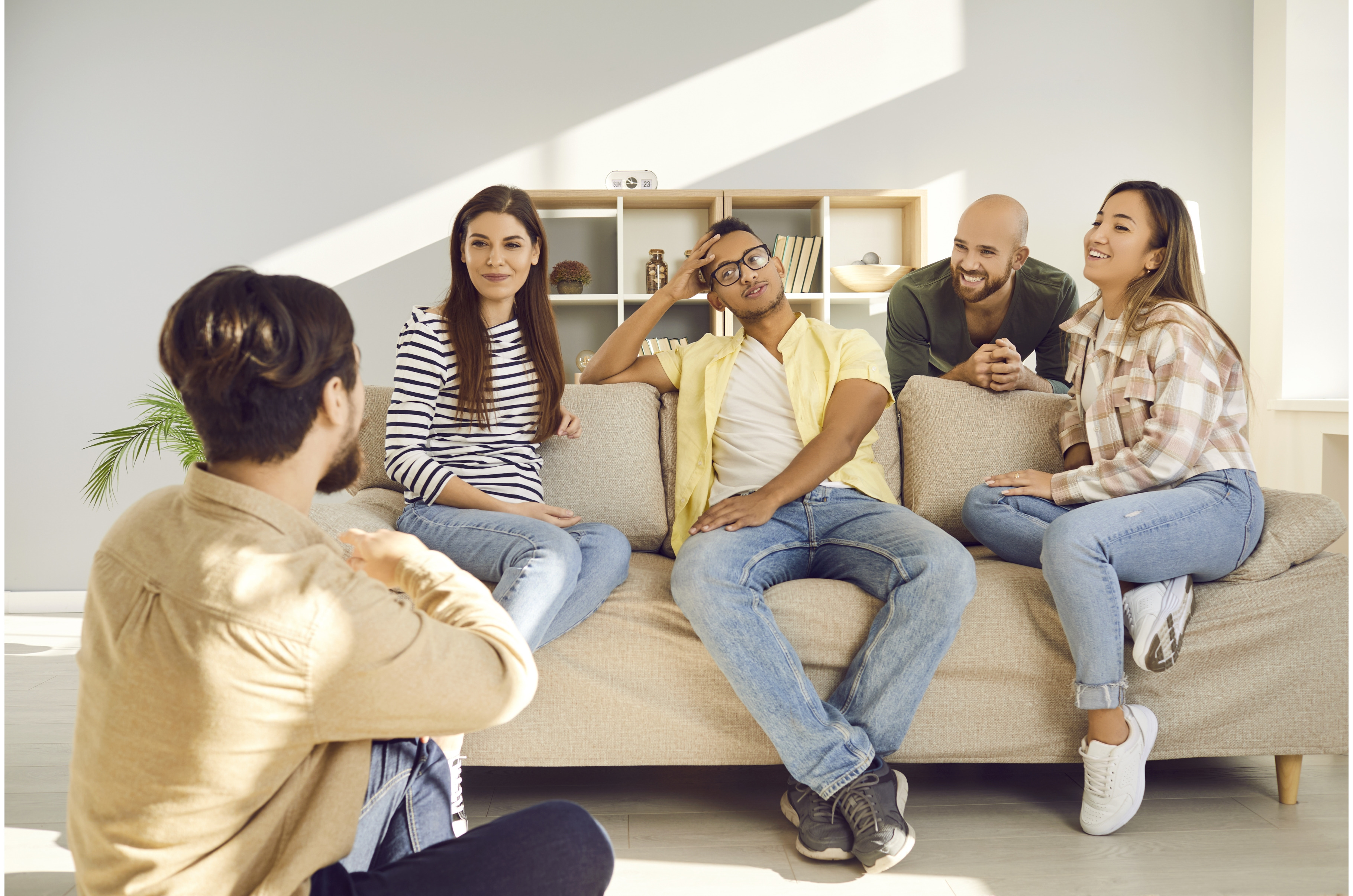 Happy young friends chatting and, a Person Photo by StudioRomantic