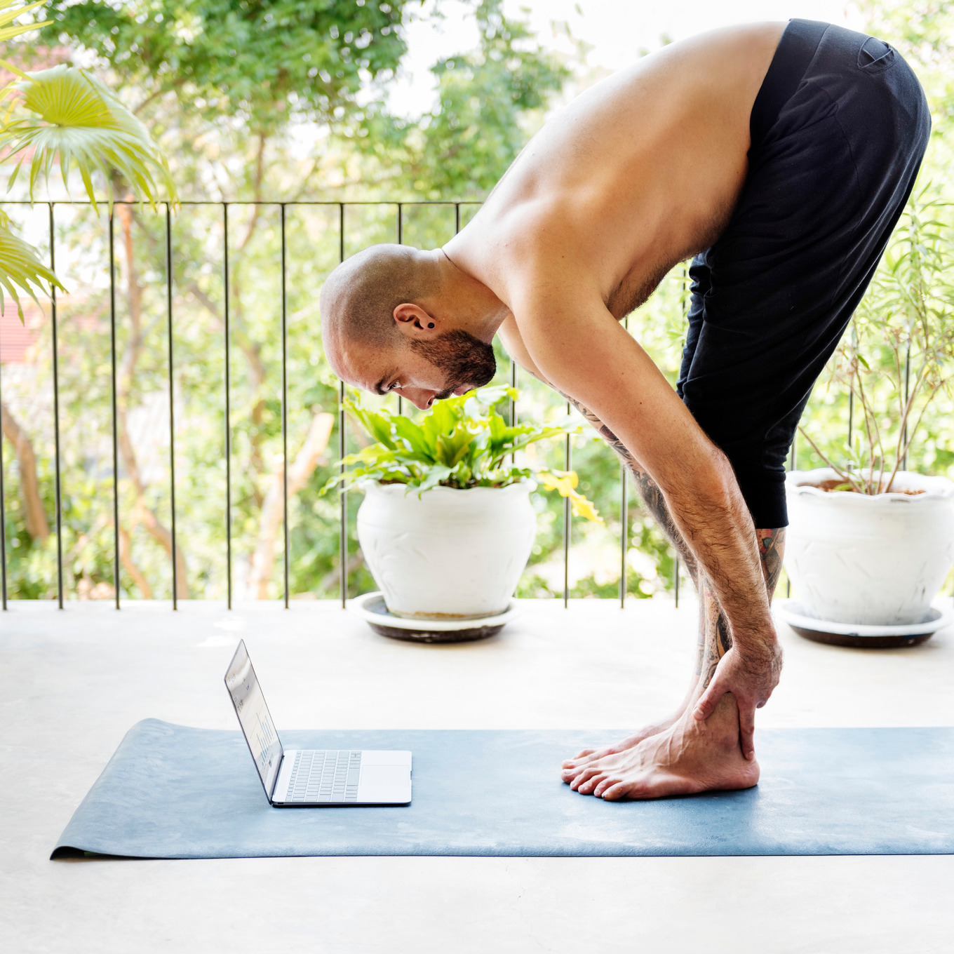 Man doing yoga, a Photo by rawpixel