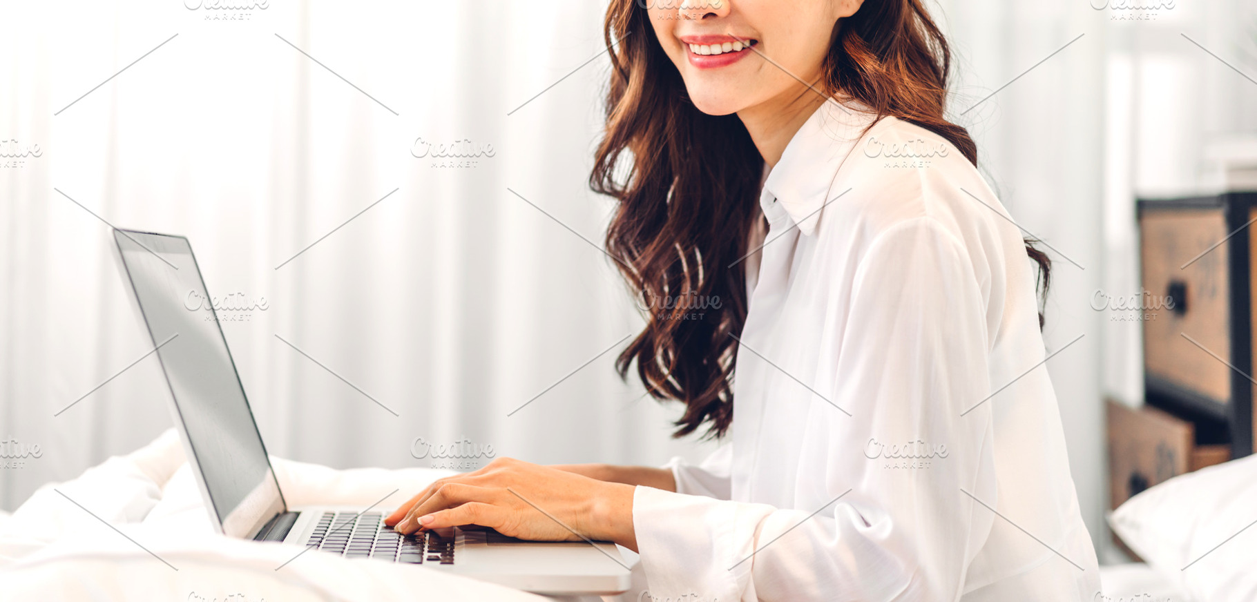 Young smiling happy beautiful asian woman relaxing using laptop, a ...