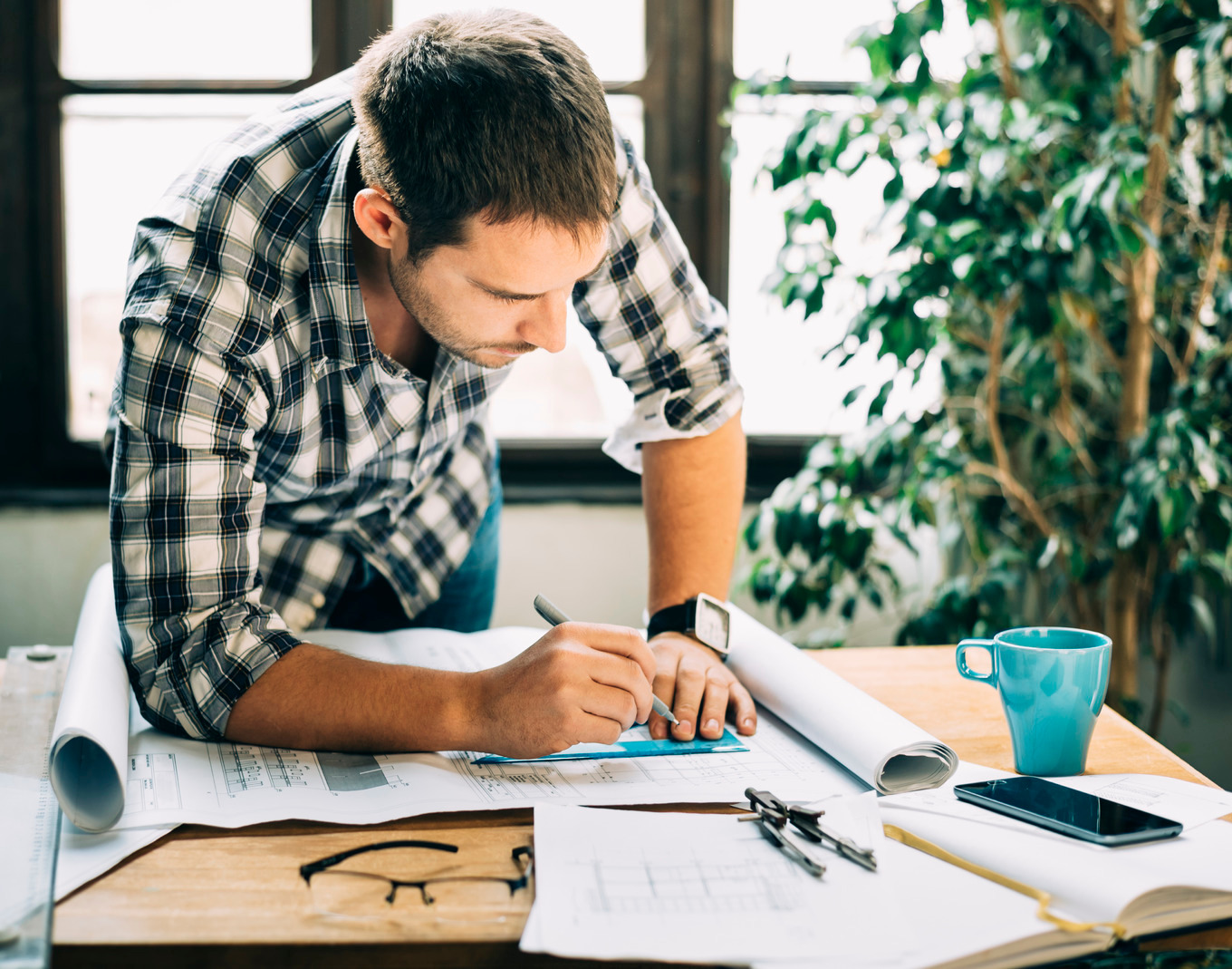 Man working on architectural project featuring man, home, and office ...