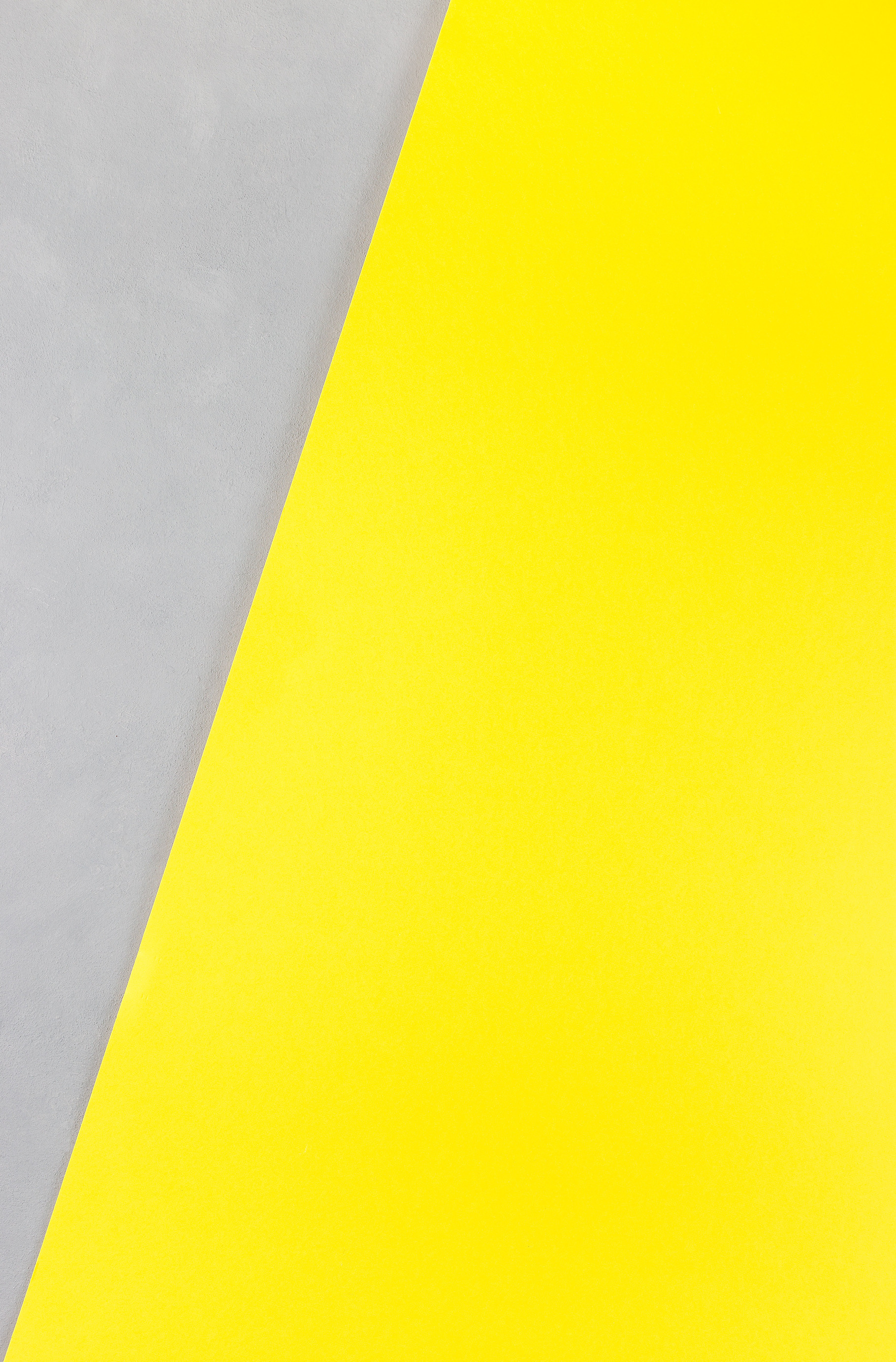 Diagonal with yellow paper and gray concrete texture, blank background ...