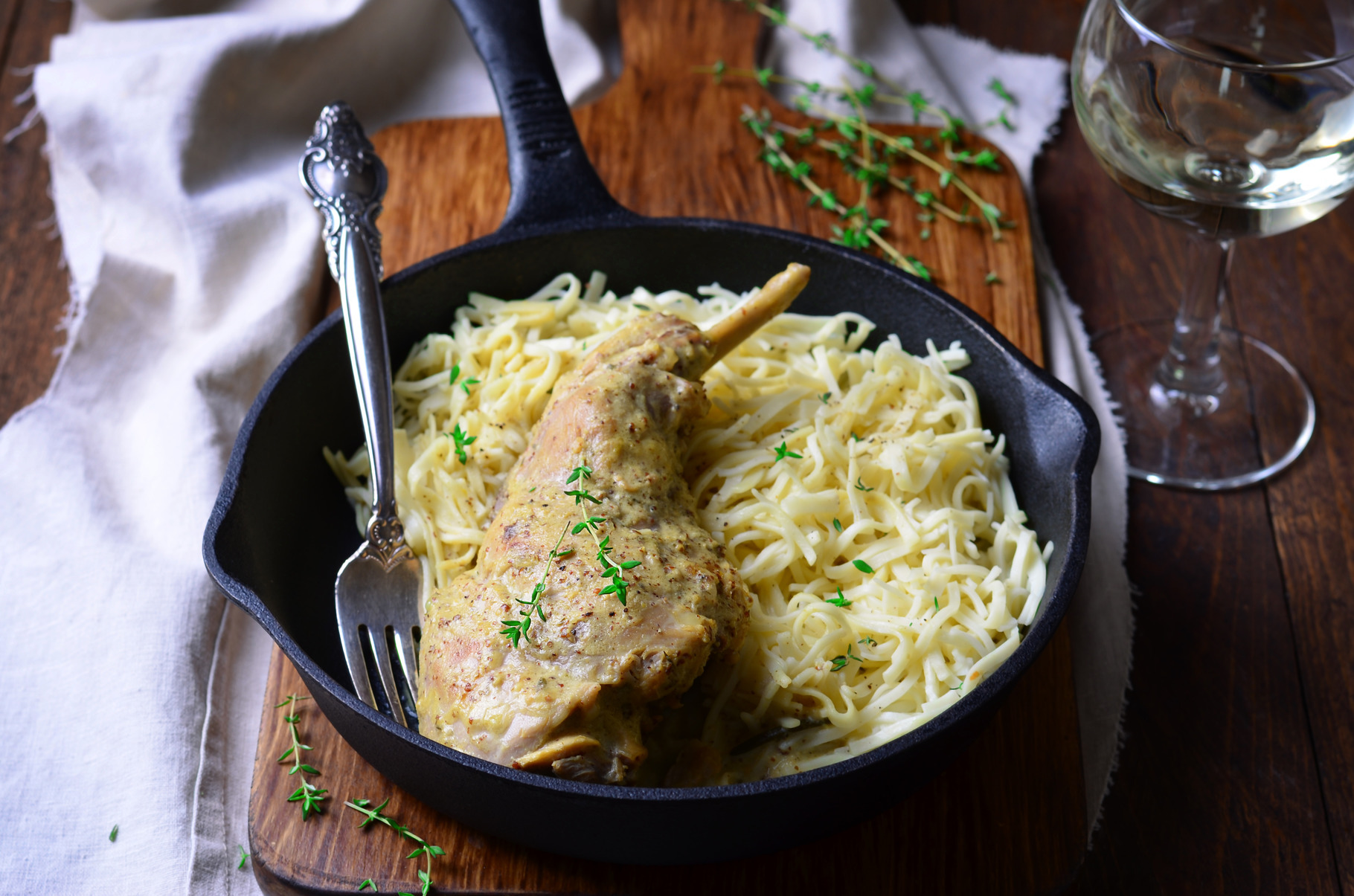 Braised rabbit leg in creamy mustard sauce with homemade noodles stock ...