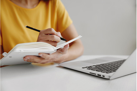 Girl student hands over notebook, a Person Photo by Stefan & Janni