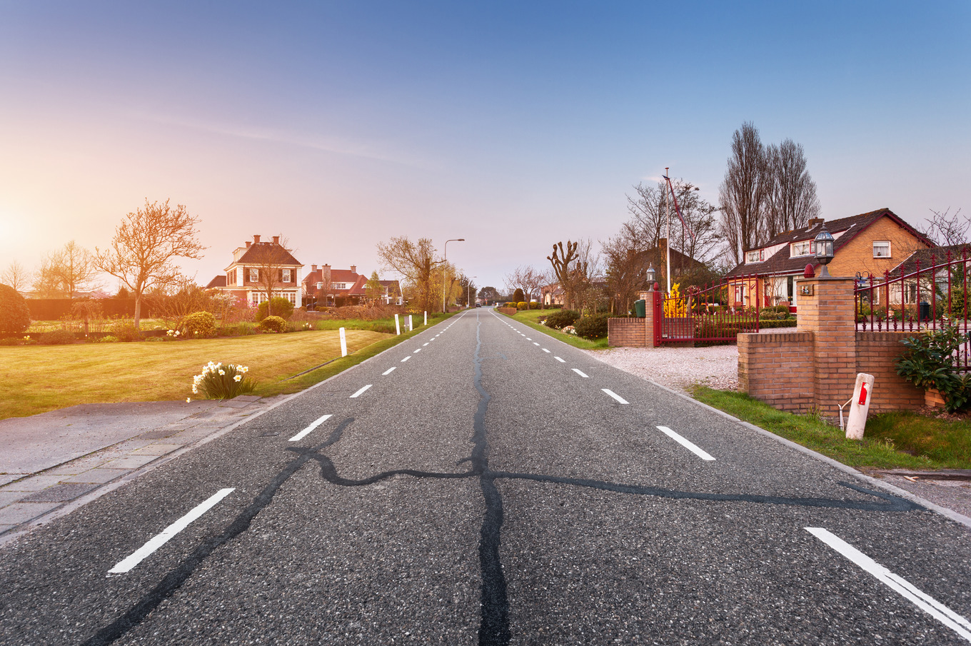 Asphalt road through the town featuring road, street, and landscape, a ...