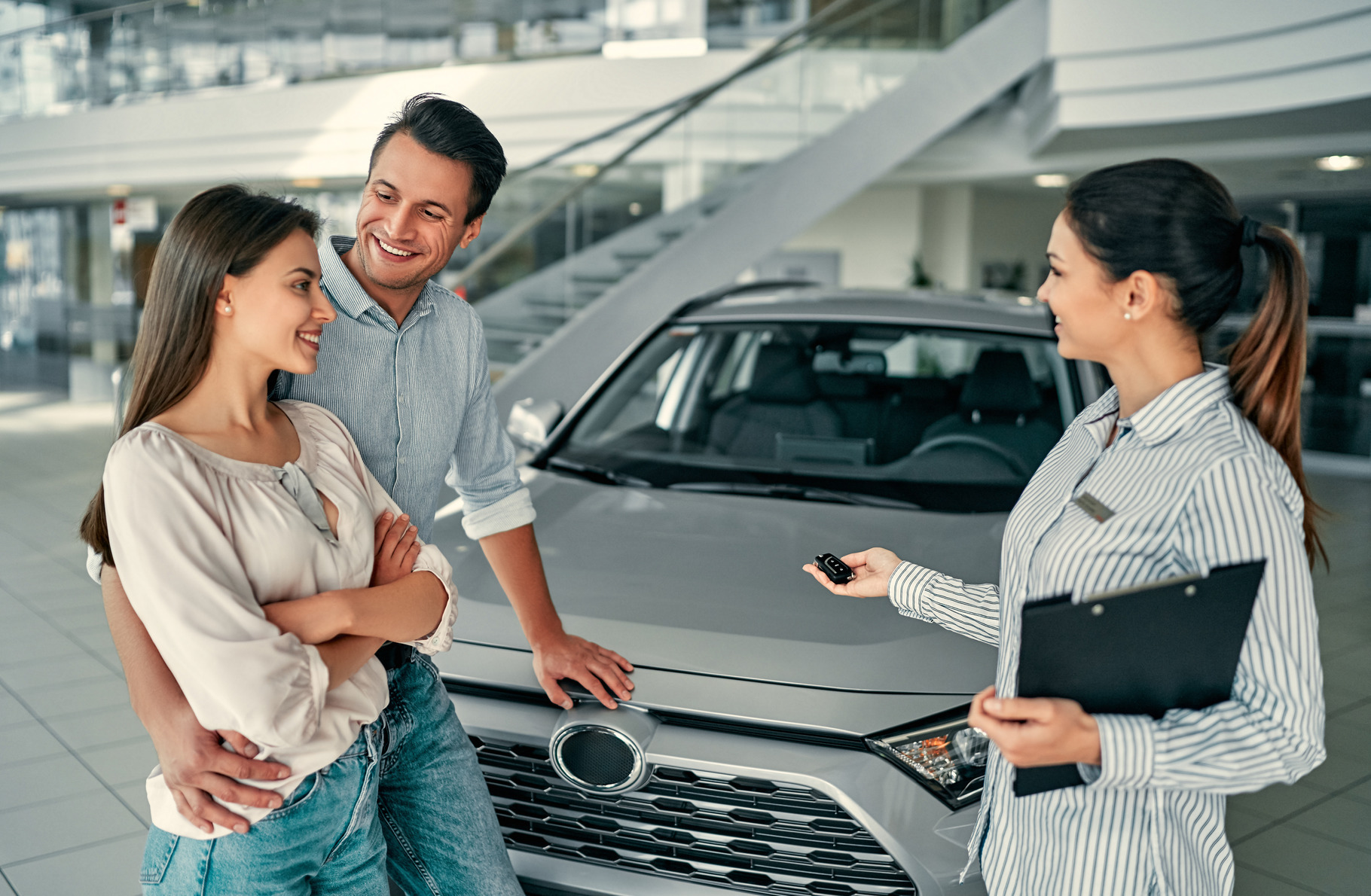 At a car dealership, buying a car, a Person Photo by ORION Production