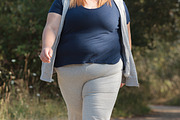 Overweight woman walking, a Photo by Ernesto Solla