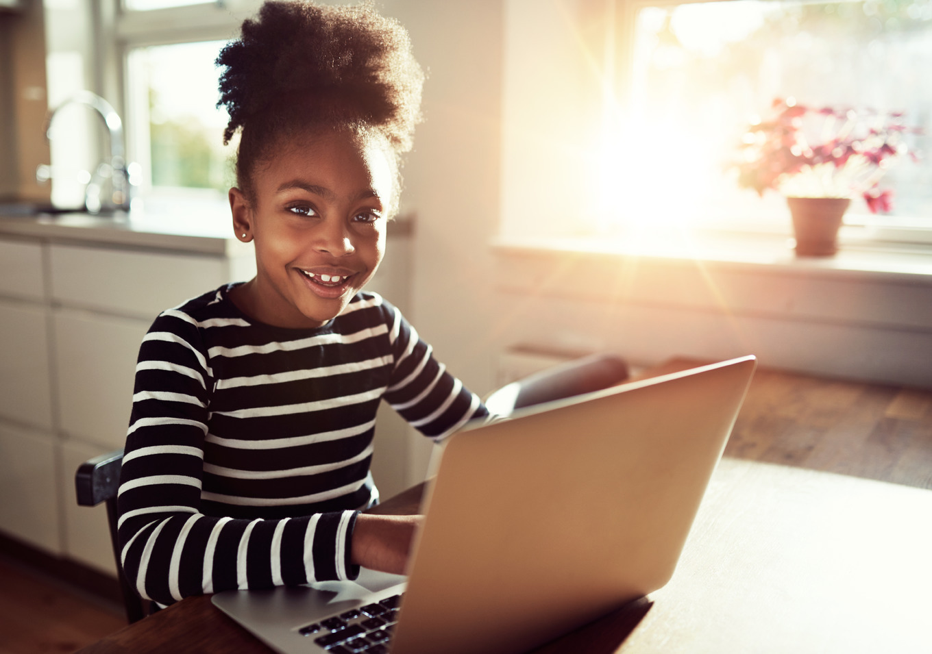 Smiling ethnic girl with a laptop, a Person Photo by Stefan & Janni