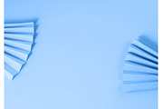 Pastel color paper fans on blue, an Abstract Photo by Lifemorning