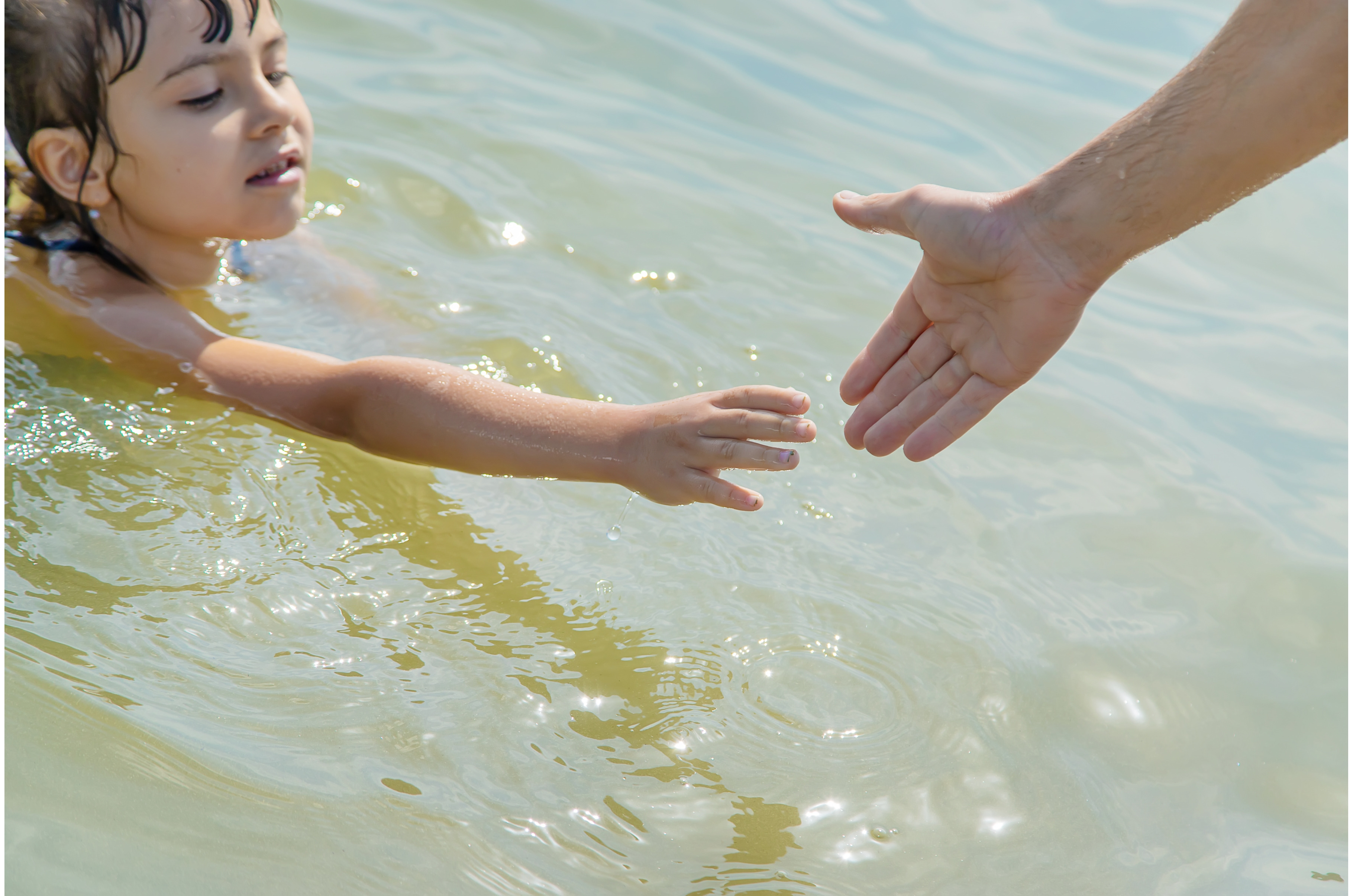 The baby is drowning in water | Nature Stock Photos ~ Creative Market
