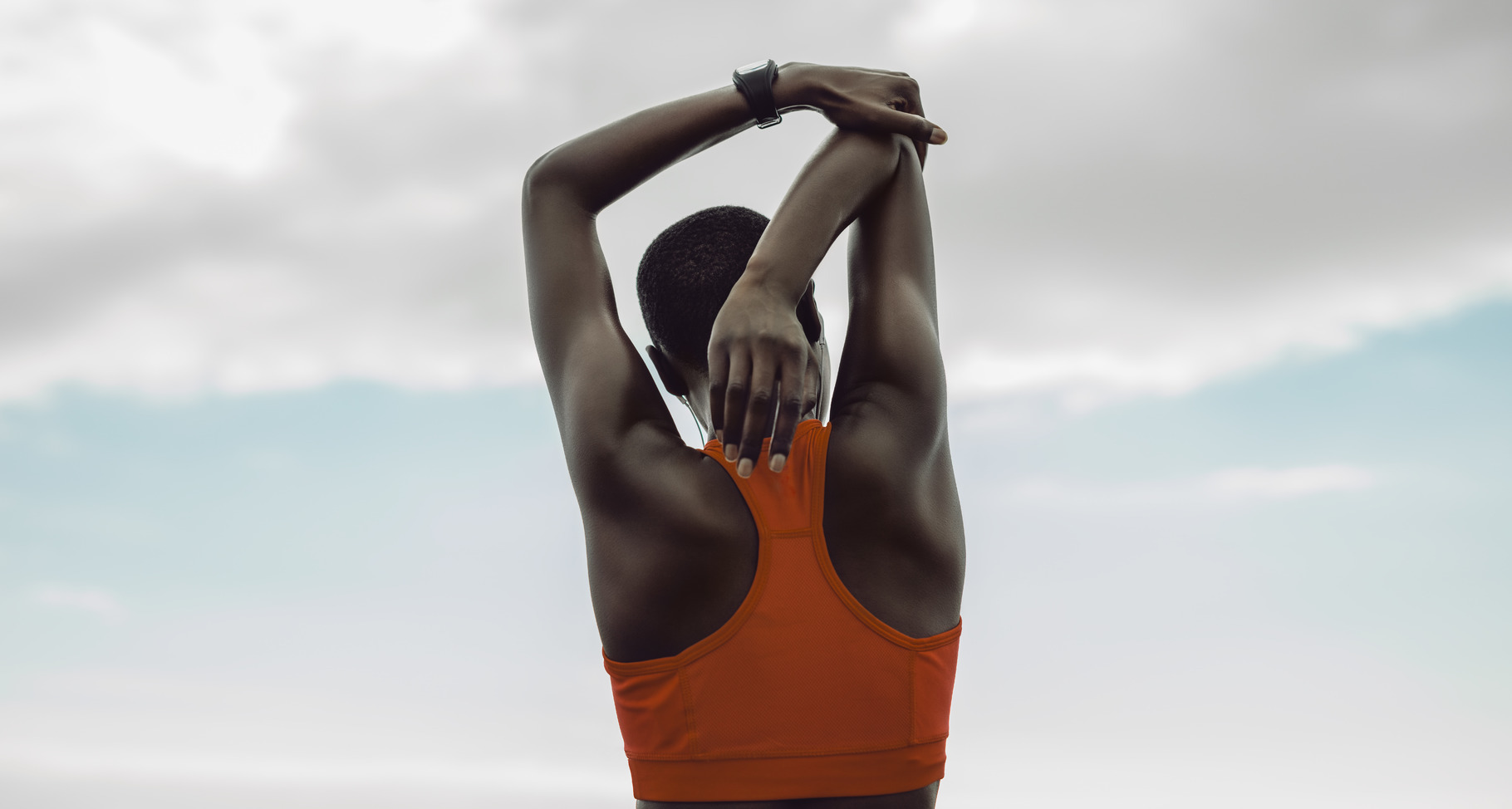 Woman doing hand stretching exercise | People Images ~ Creative Market