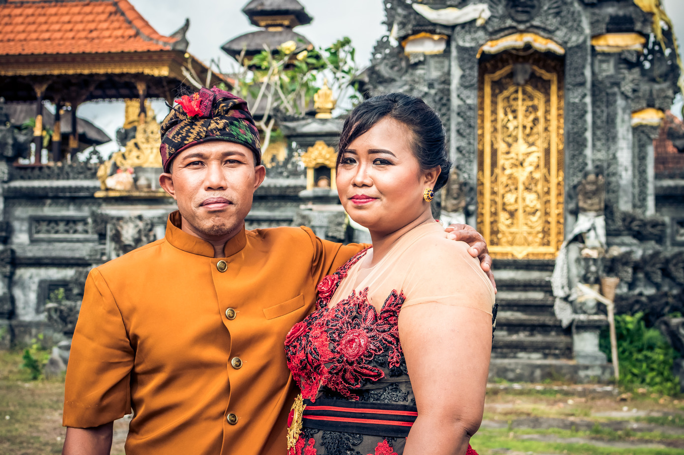 Lovely honeymoon balinese couple in traditional clothes together at the ...
