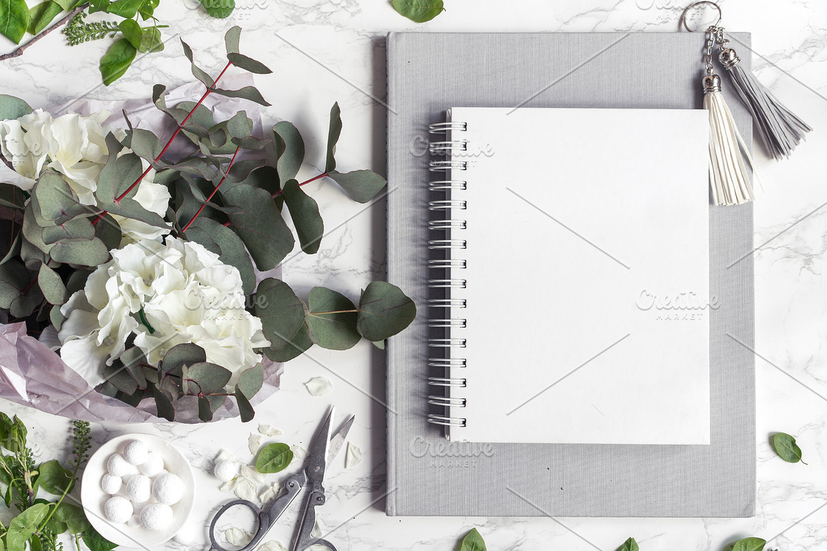 Notepad mockup with flowers., a Household Mockup by Una Matison