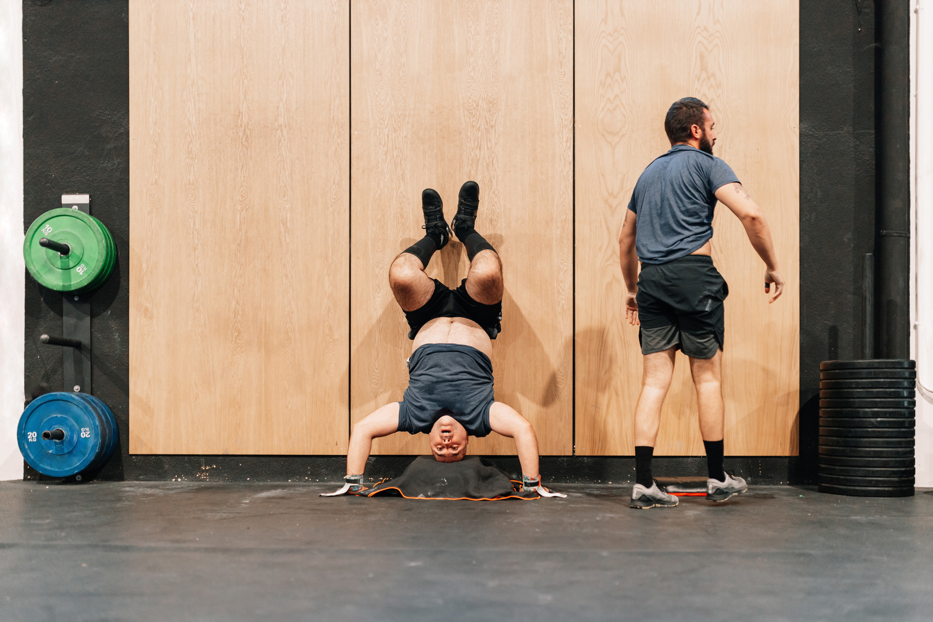 Two men training on floor in a gym d, a Sports & Recreation Photo by ...