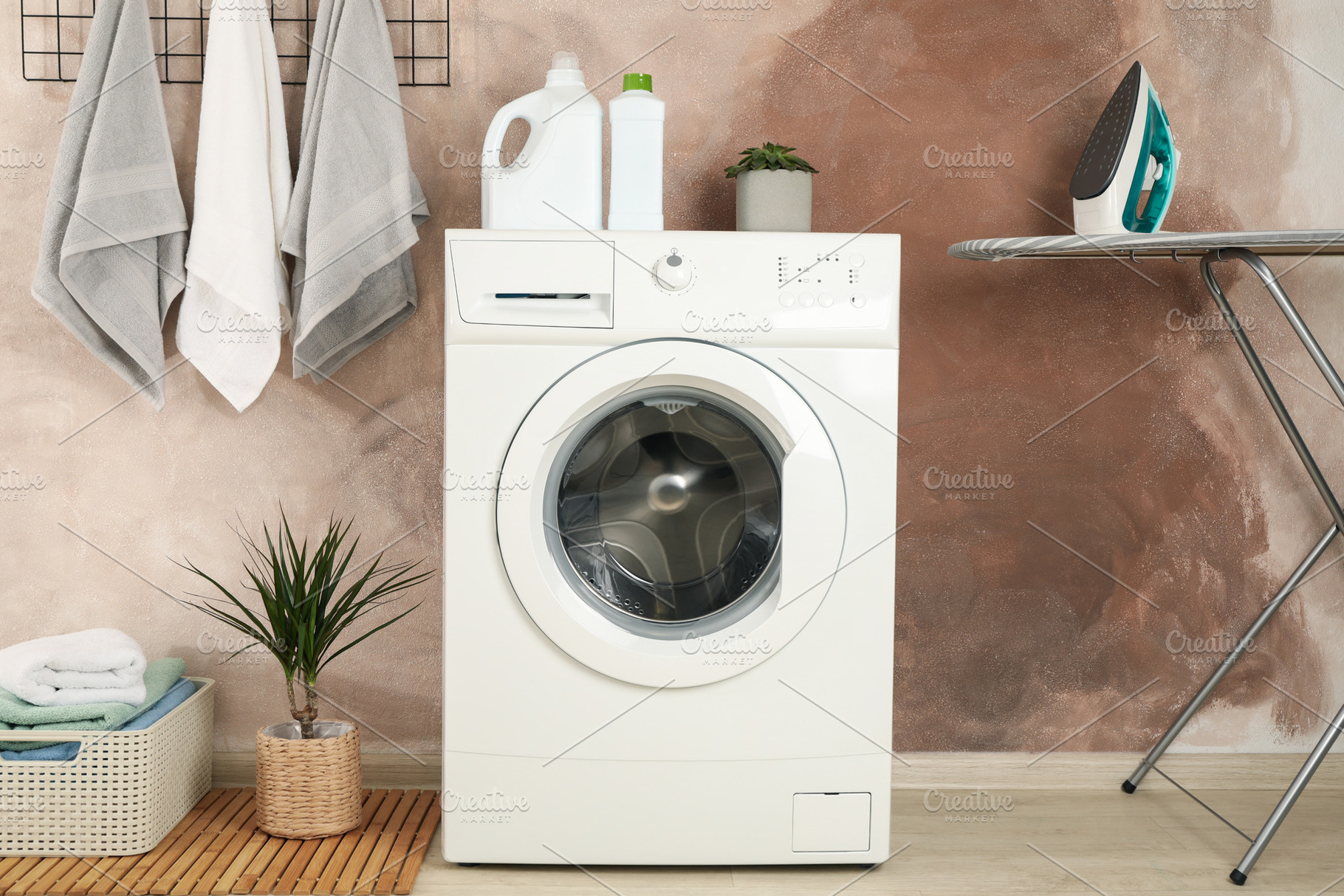 Laundry room with washing machine against brown wall, an Industrial ...