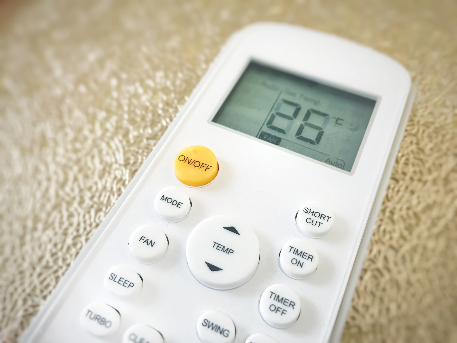 Display of an air conditioner remote featuring 26, air, and air ...