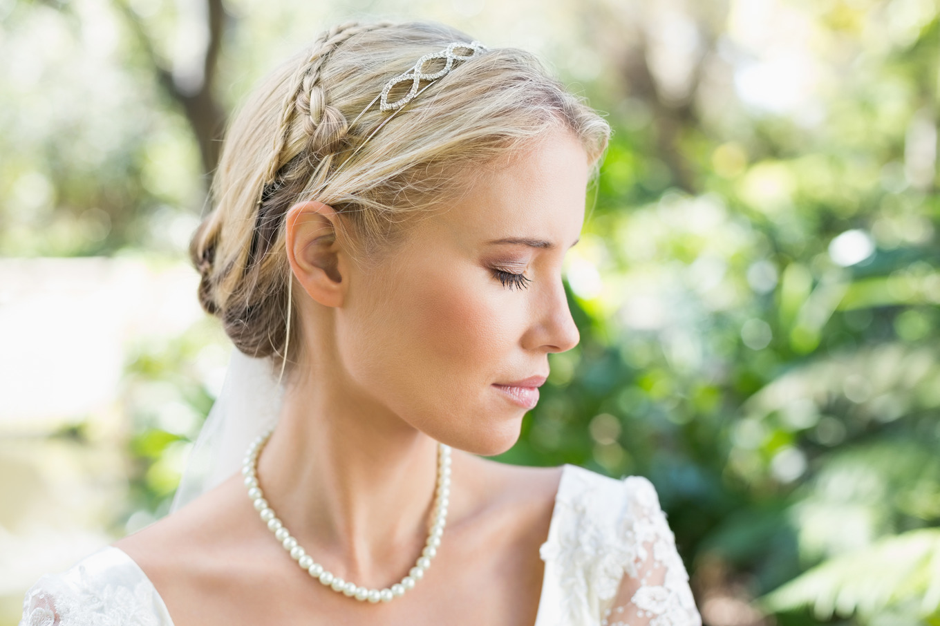 Blonde bride wearing pearls, a Photo by wavebreak