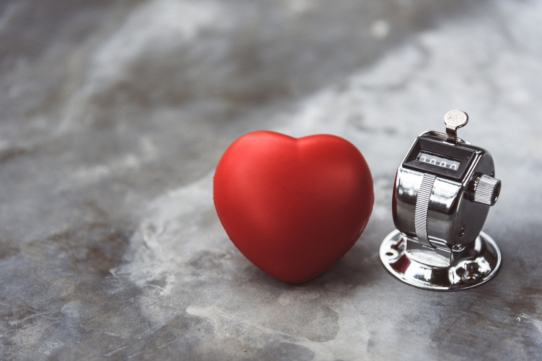 Heart and countdown counter on marble table surface. Medical and, a ...