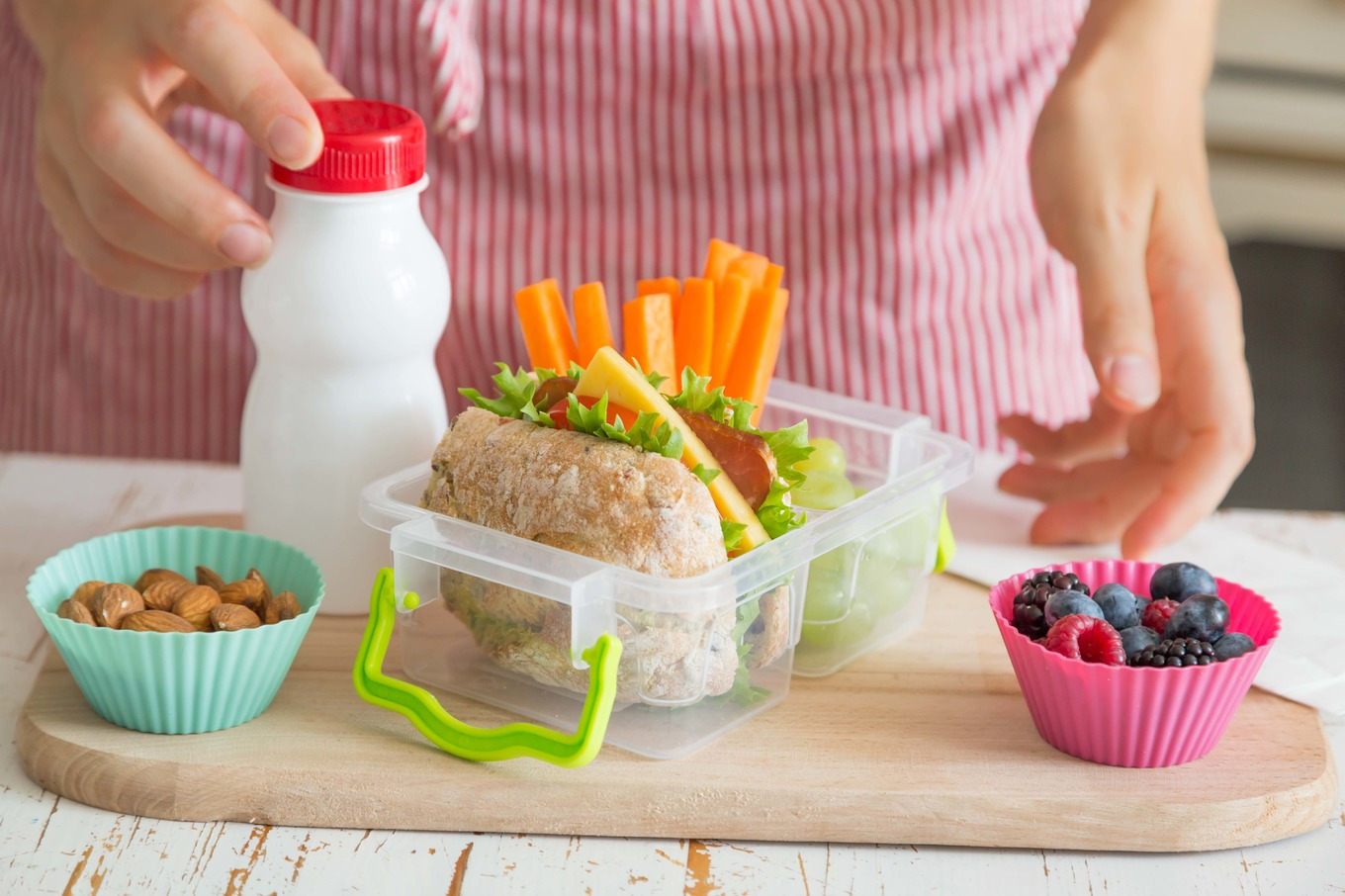 Mother making school lunch in the kitchen containing lunch, school, and ...