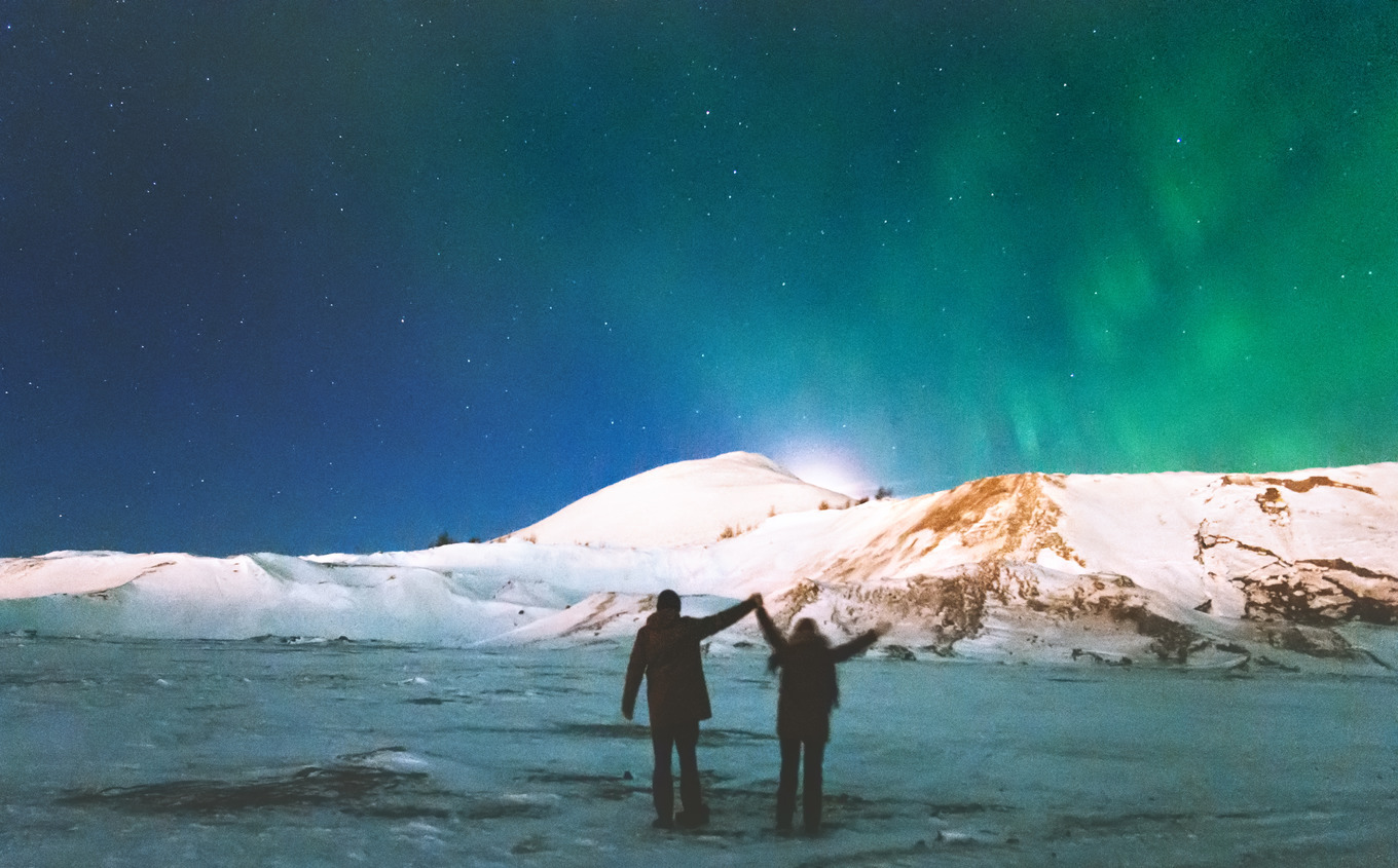 Couple enjoying Northern lights, a Person Photo by e v e r s t
