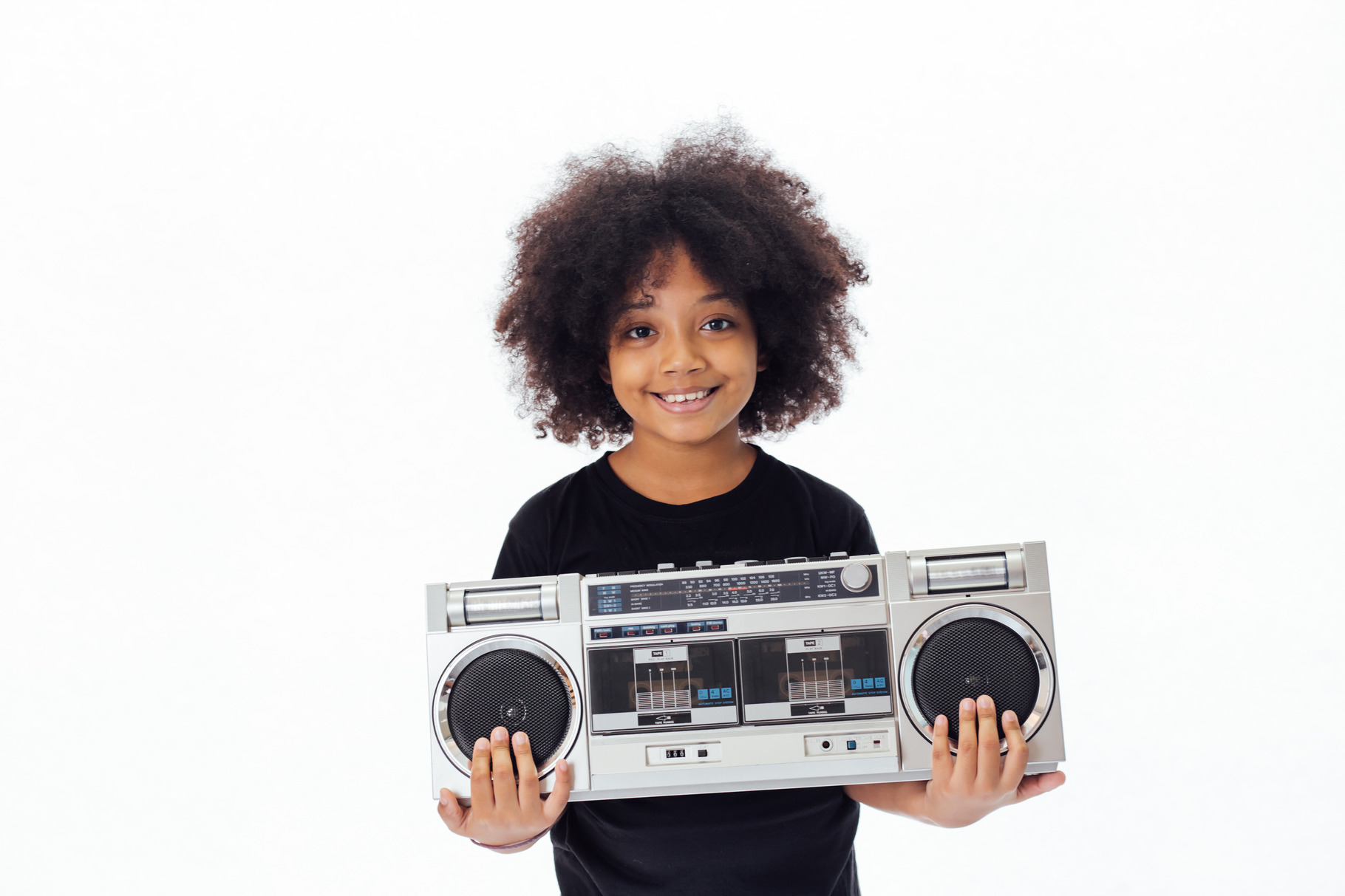 Cute and smiling african american kid holding a musical jukebox ...