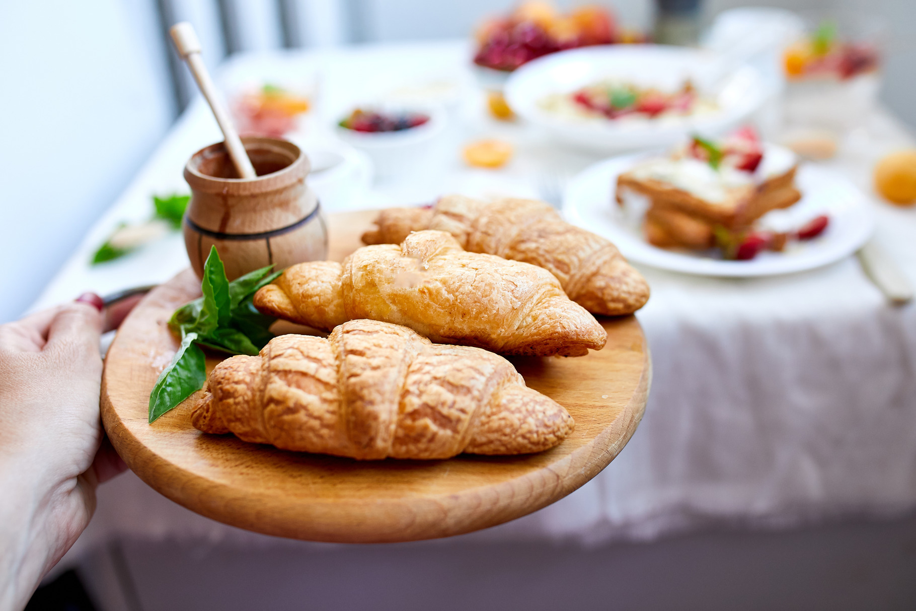 Continental breakfast table served featuring french, croissant, and, an ...