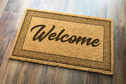 Welcome mat on a wood floor featuring home, welcome, and welcome mat ...