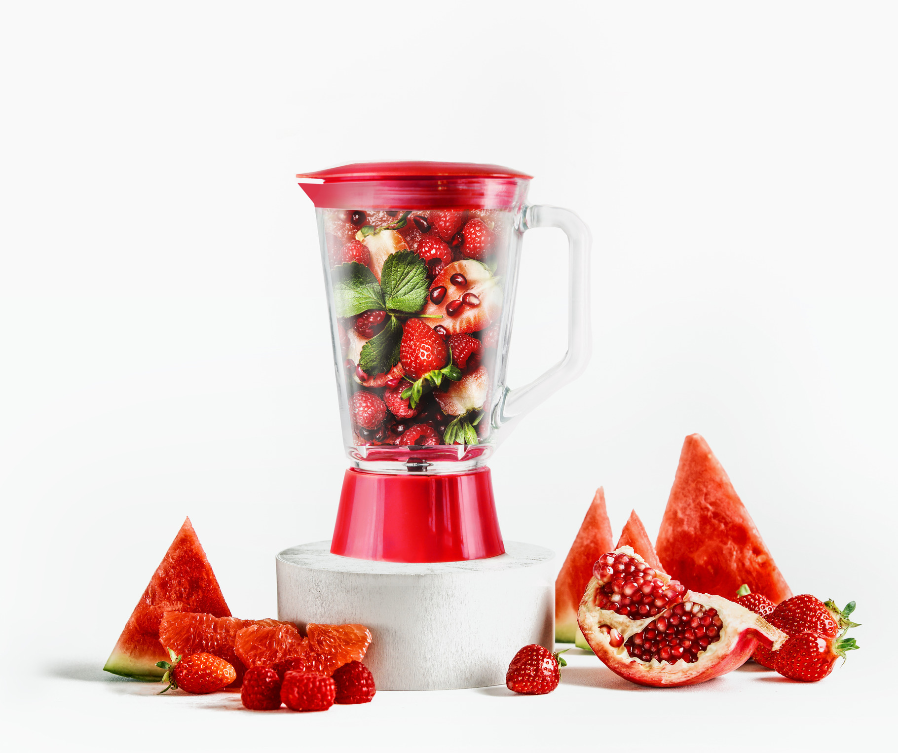 Blender with red fruits on podium | Creative Market