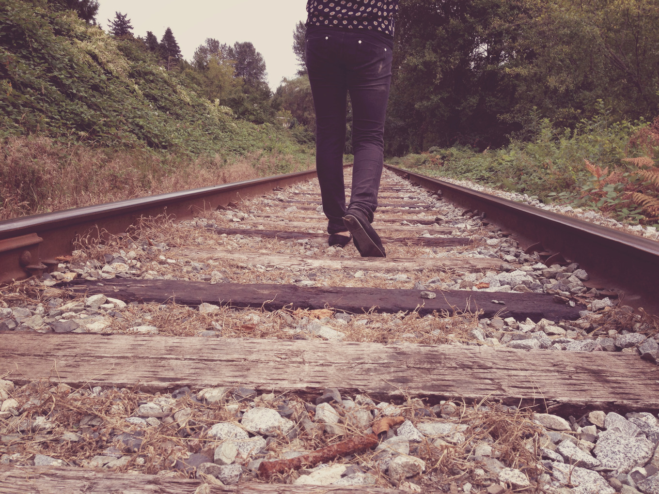 Walking on train tracks, a Person Photo by EnjoyLife | Creative Market