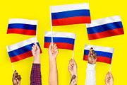 Hands waving the flags of Russia, a Background Photo by rawpixel