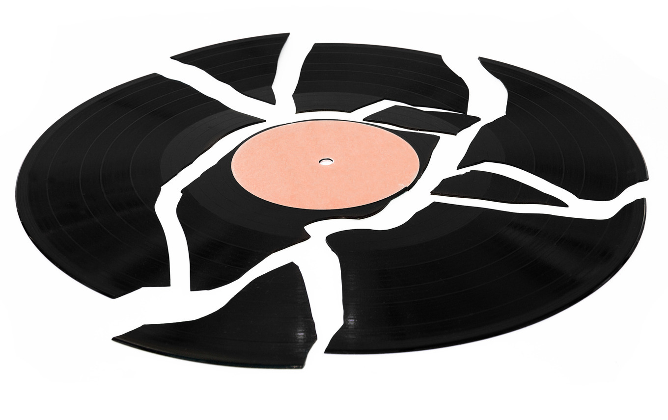 Broken 12 inch vinyl record containing broken, record, and record ...
